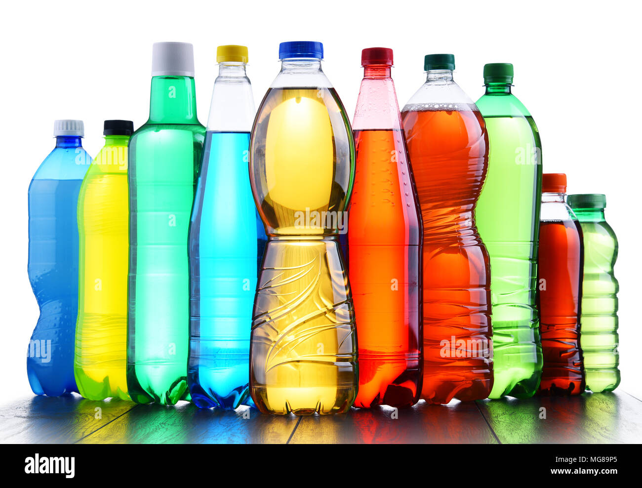 Plastic bottles of assorted carbonated soft drinks in variety of colors ...