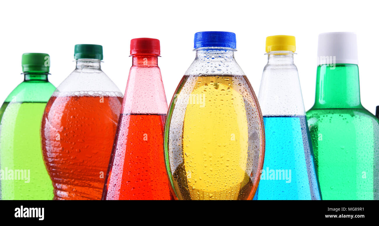 Plastic bottles of assorted carbonated soft drinks in variety of colors ...