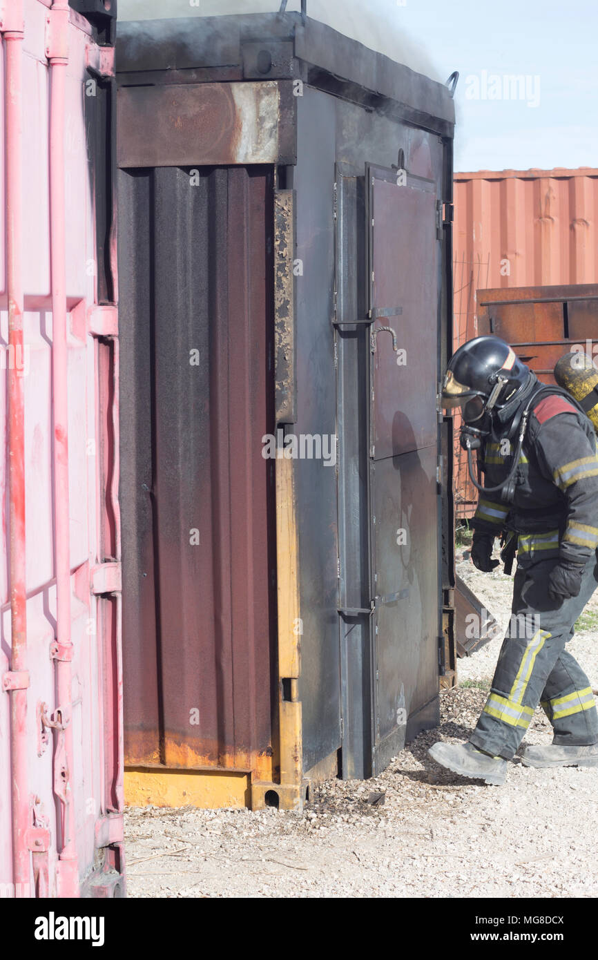 Firefighter putting out fire training station extinguisher backdraft ...