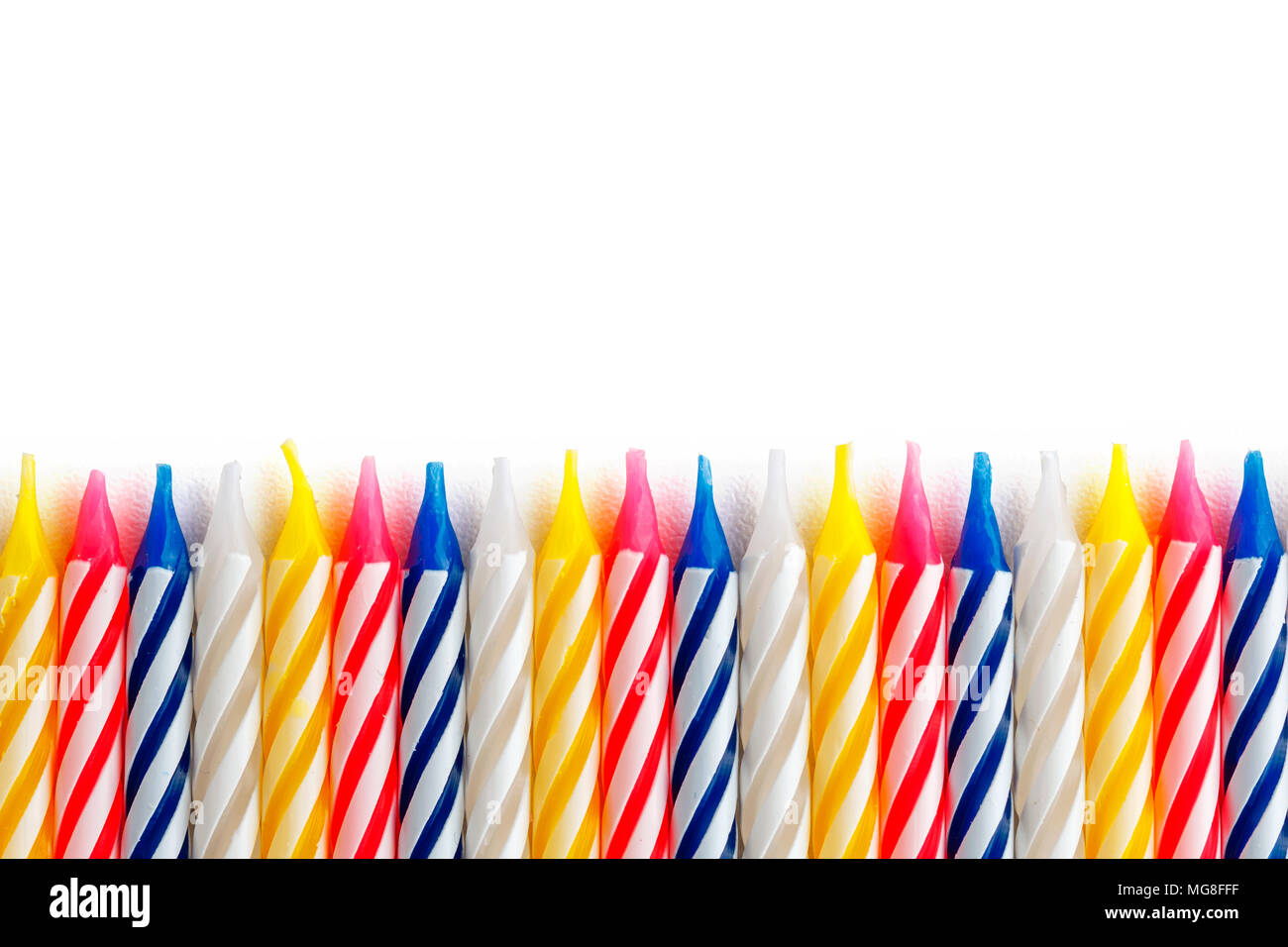 holiday candles lined up in a row on a white background isolate ...