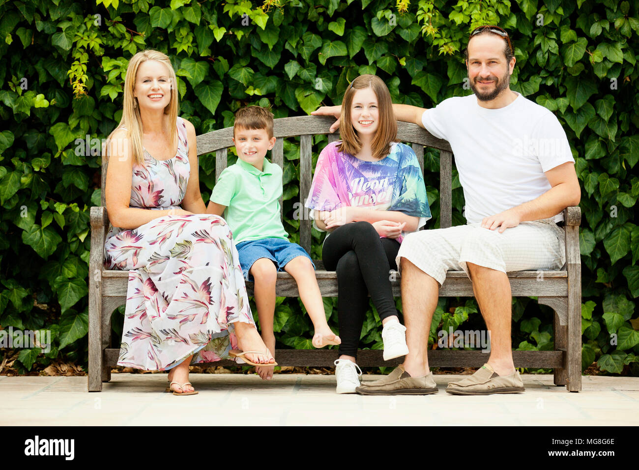 Portrait shoot outdoors on wooden bench Stock Photo - Alamy