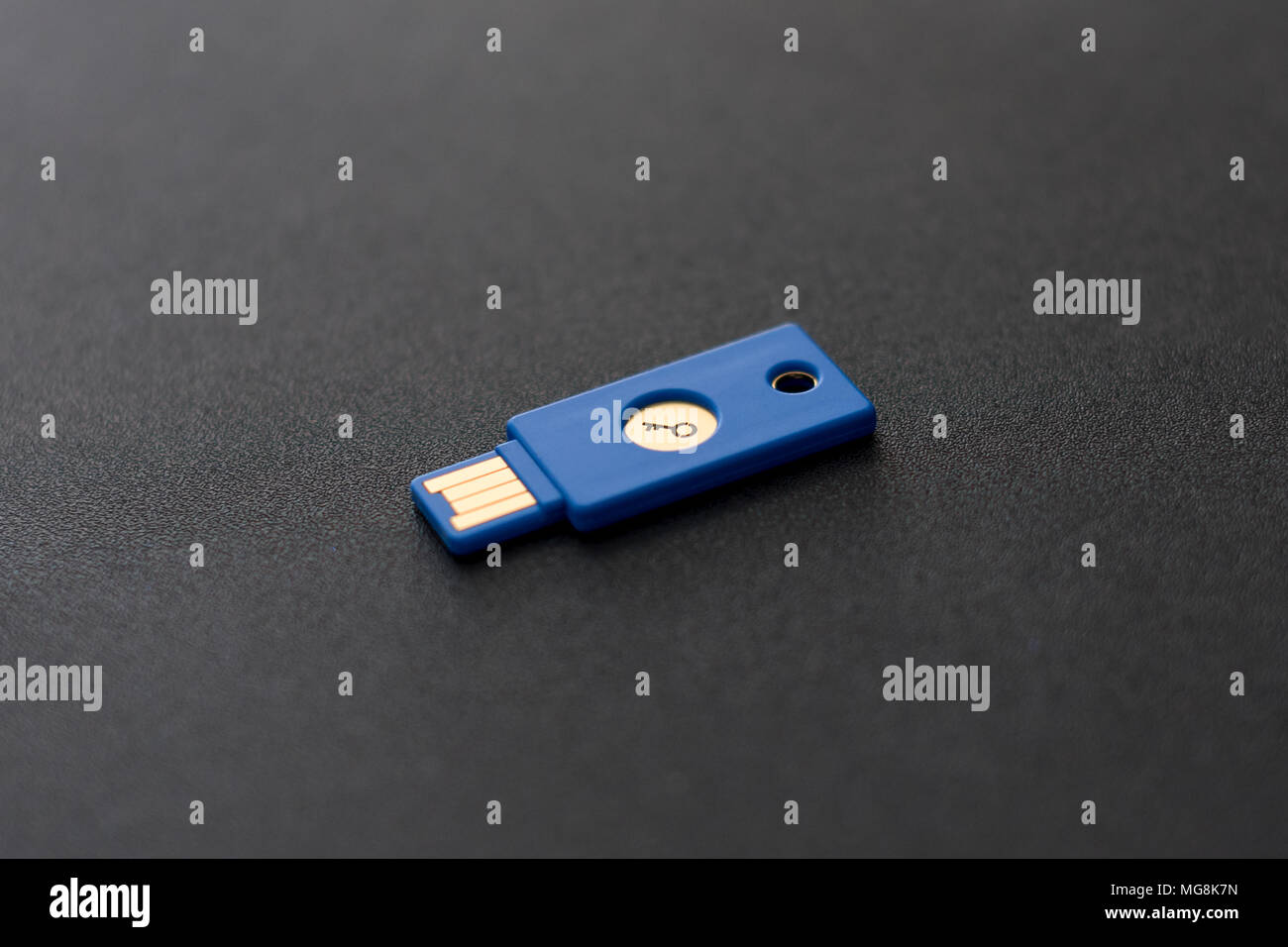 Security system concept. Key-shaped USB drive on dark background ...
