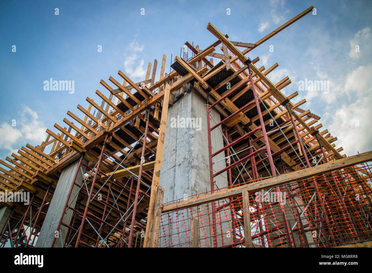 A building in the first stages of construction, with scaffolding around ...