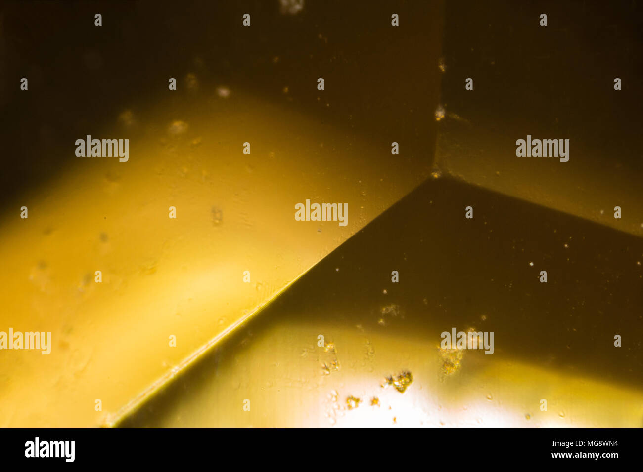 Yellow gem under the microscope. Closeup macro photography Stock Photo ...