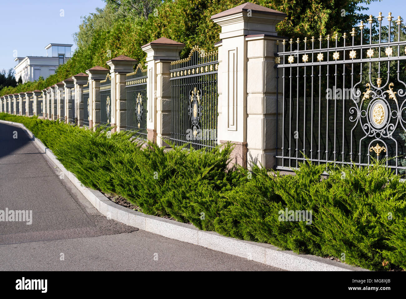 Metal forged fence Stock Photo - Alamy