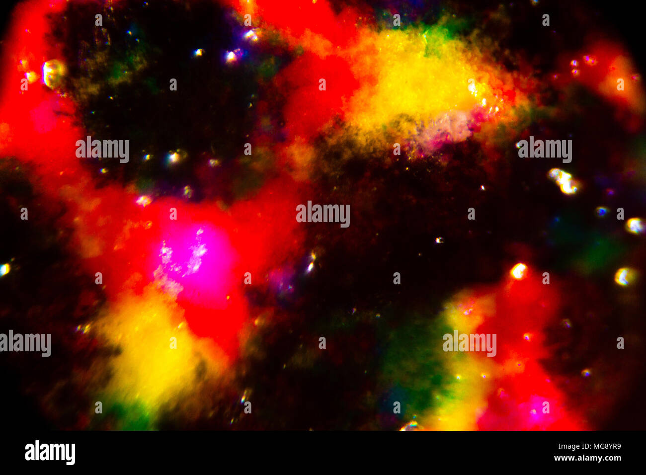 Abstract ink spot in many color print on flyer paper under the ...