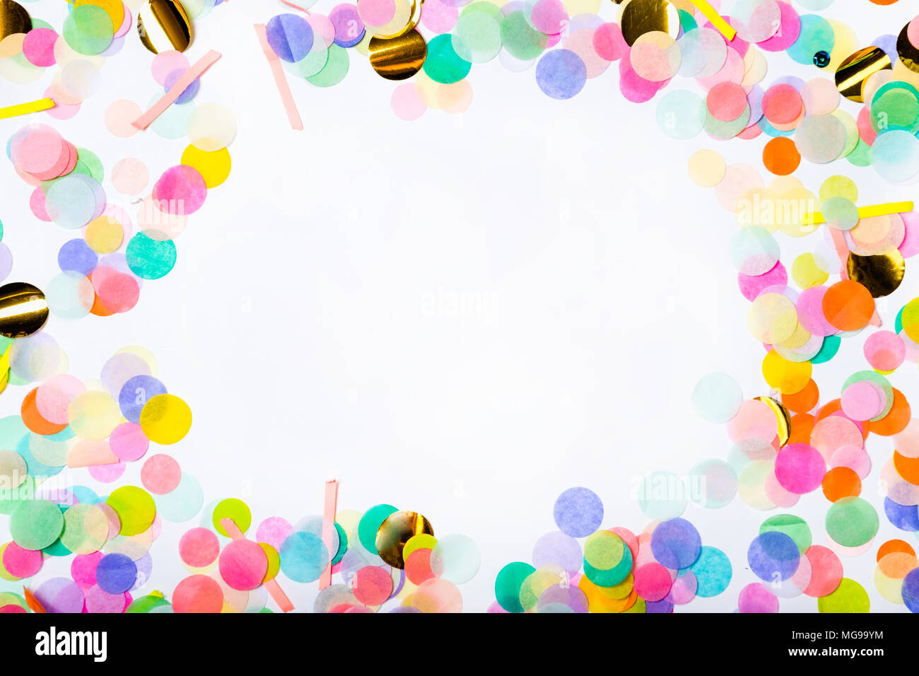 Frame made of colorful confetti on white background. Color party ...
