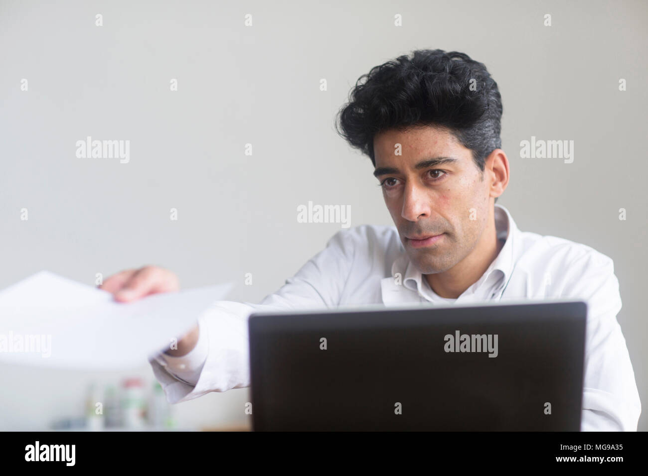 Healthcare professional working laptop hi-res stock photography and ...