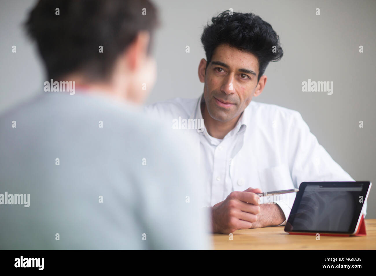 Doctor with paperwork Stock Photo - Alamy