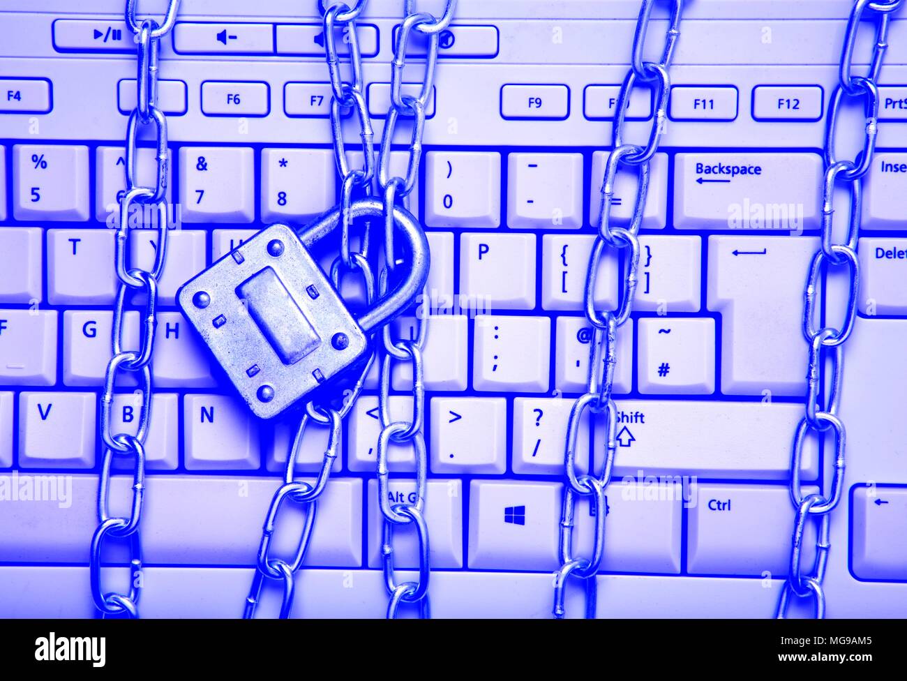 Computer keyboard with metal chains and padlock Stock Photo - Alamy