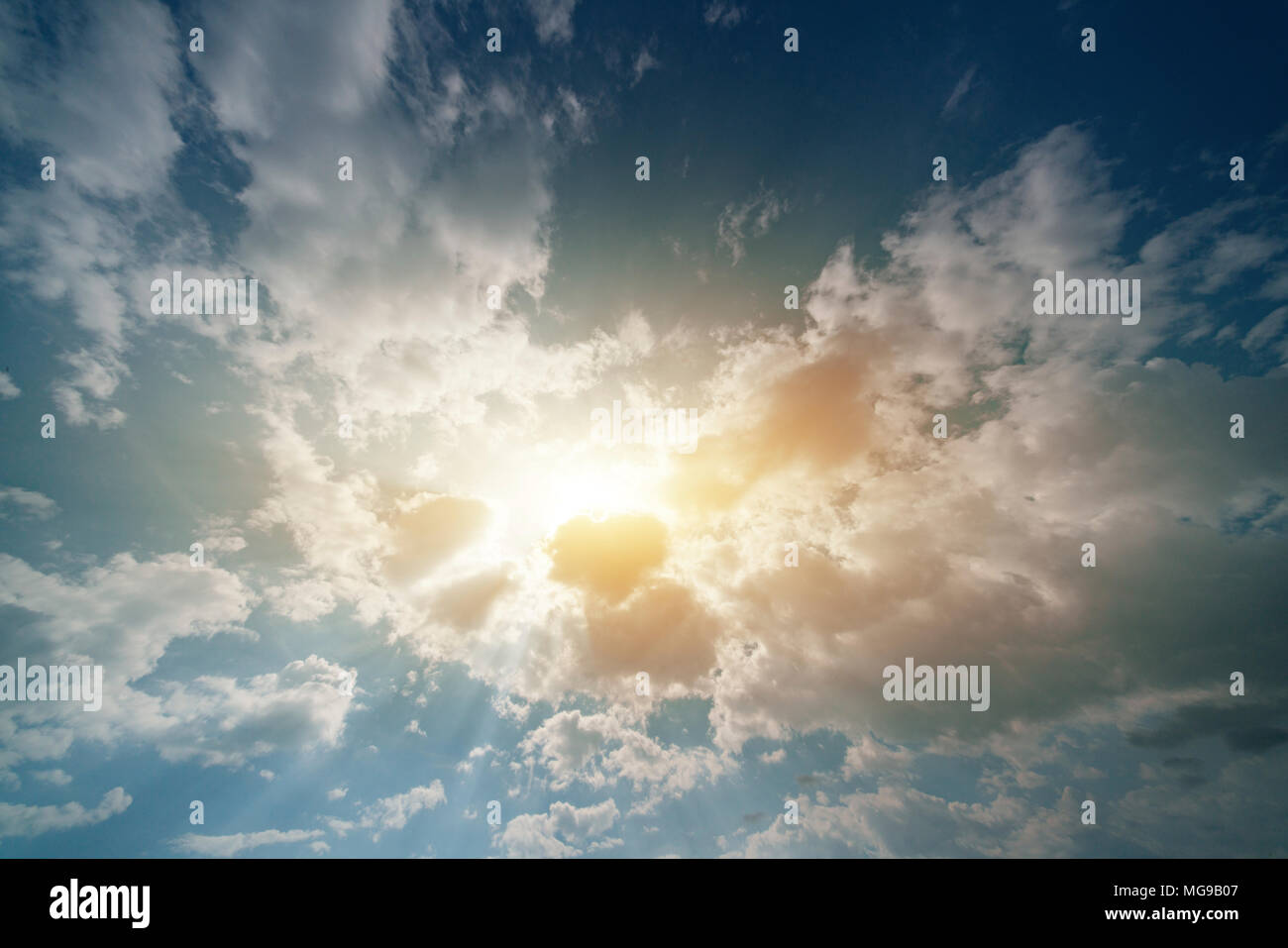 Sun and cloudy sky Stock Photo - Alamy
