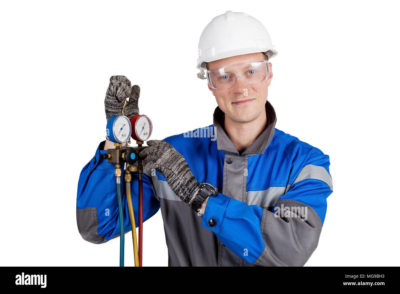 Builder, installer of ventilation with tools in hands Stock Photo - Alamy