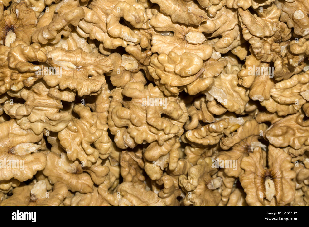 background - golden kernels of peeled walnuts Stock Photo - Alamy