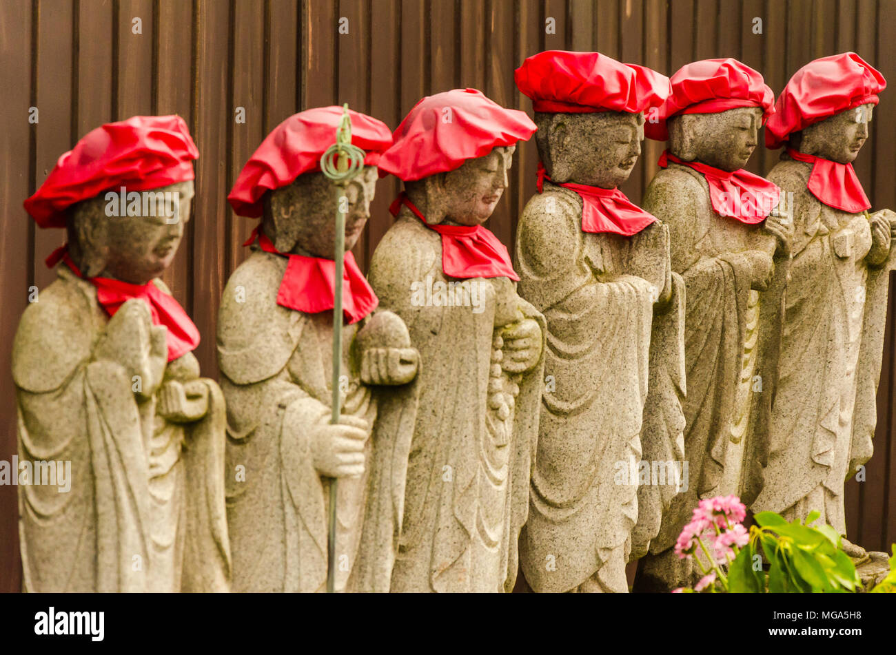 Praying stone monk statues hi-res stock photography and images - Alamy