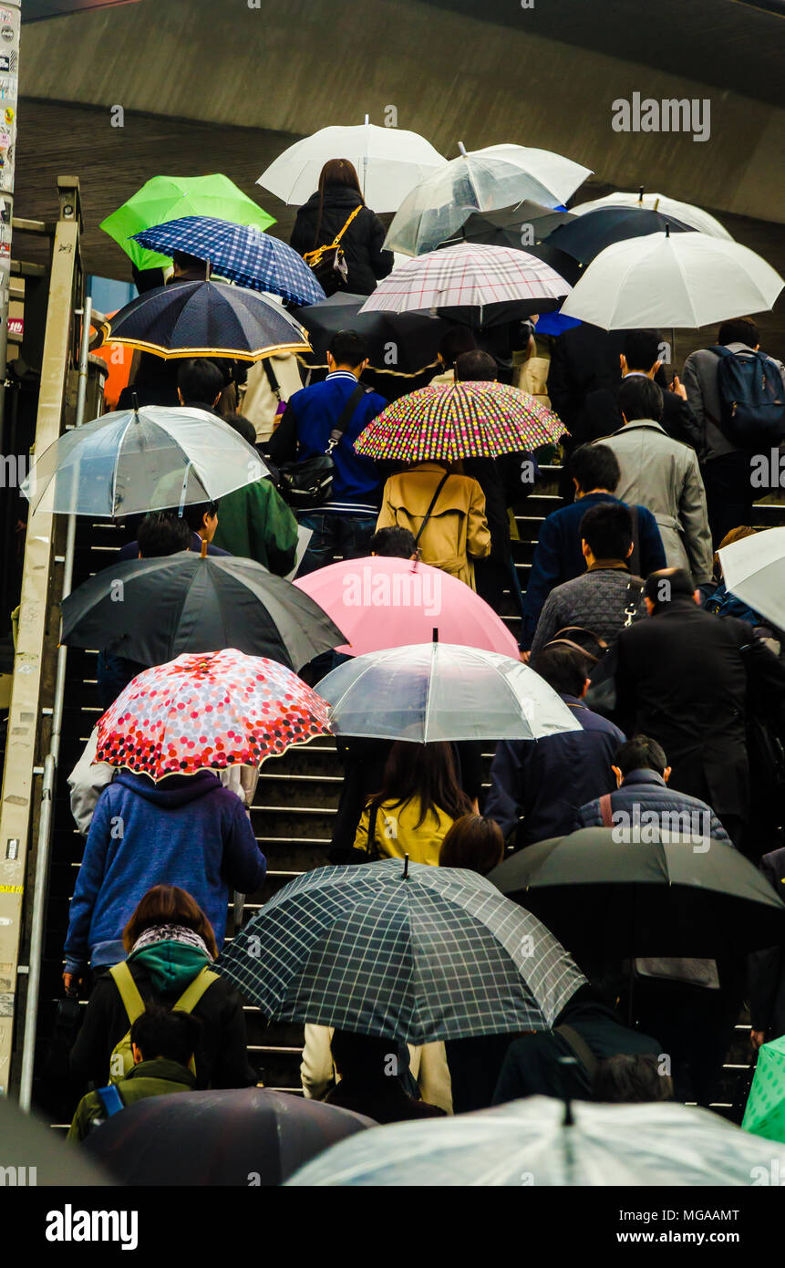 Morning office rush hour with rain and umbrella in Tokyo Stock Photo ...