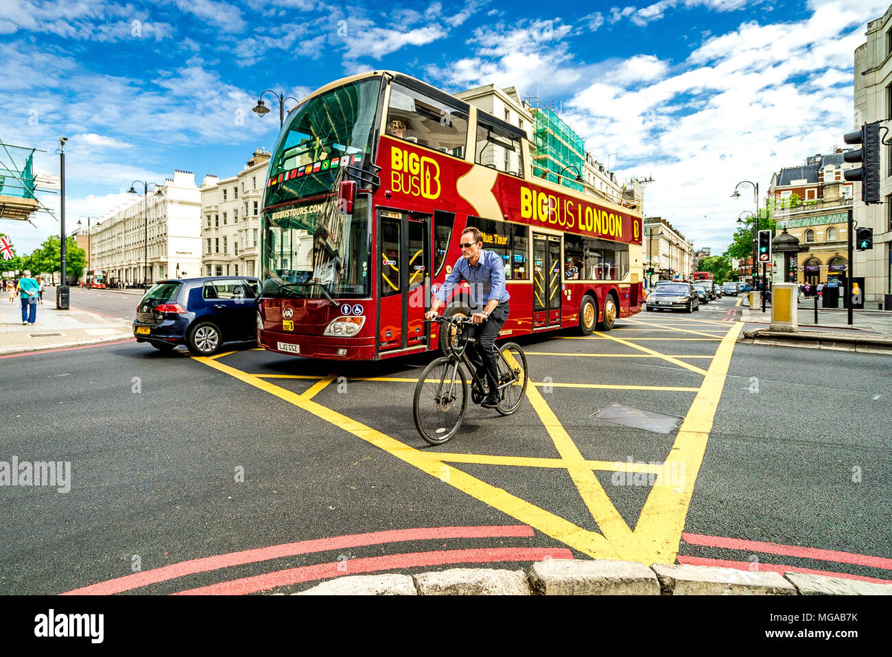 Big Bus London and cyclist on a London street Stock Photo - Alamy