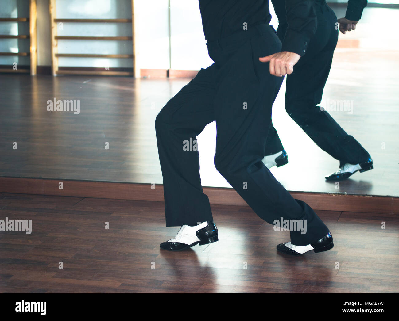 Ballroom dance male dancer and teacher in studio school dancing in ...