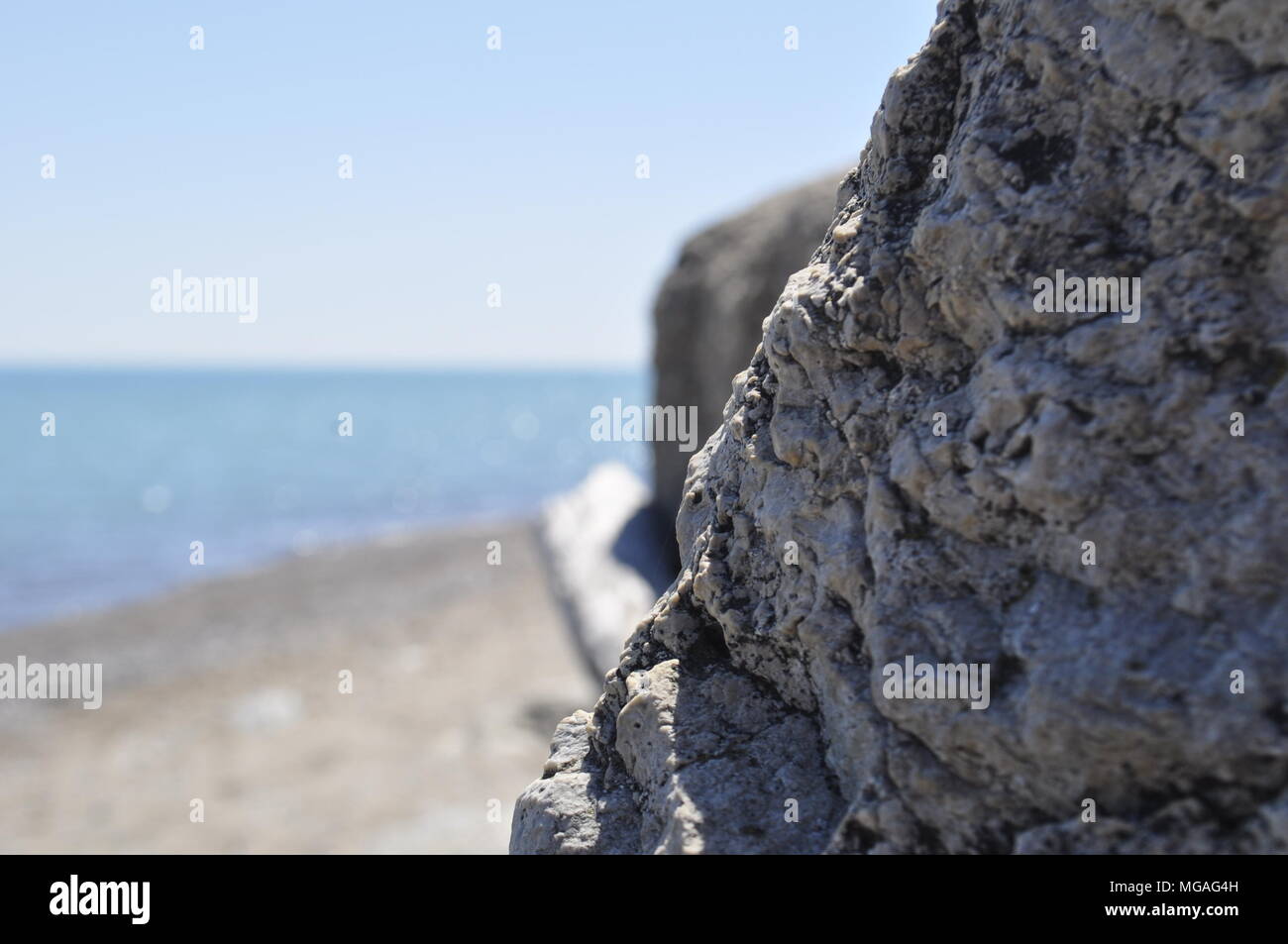 Rocks Along The Beach Stock Photo - Alamy