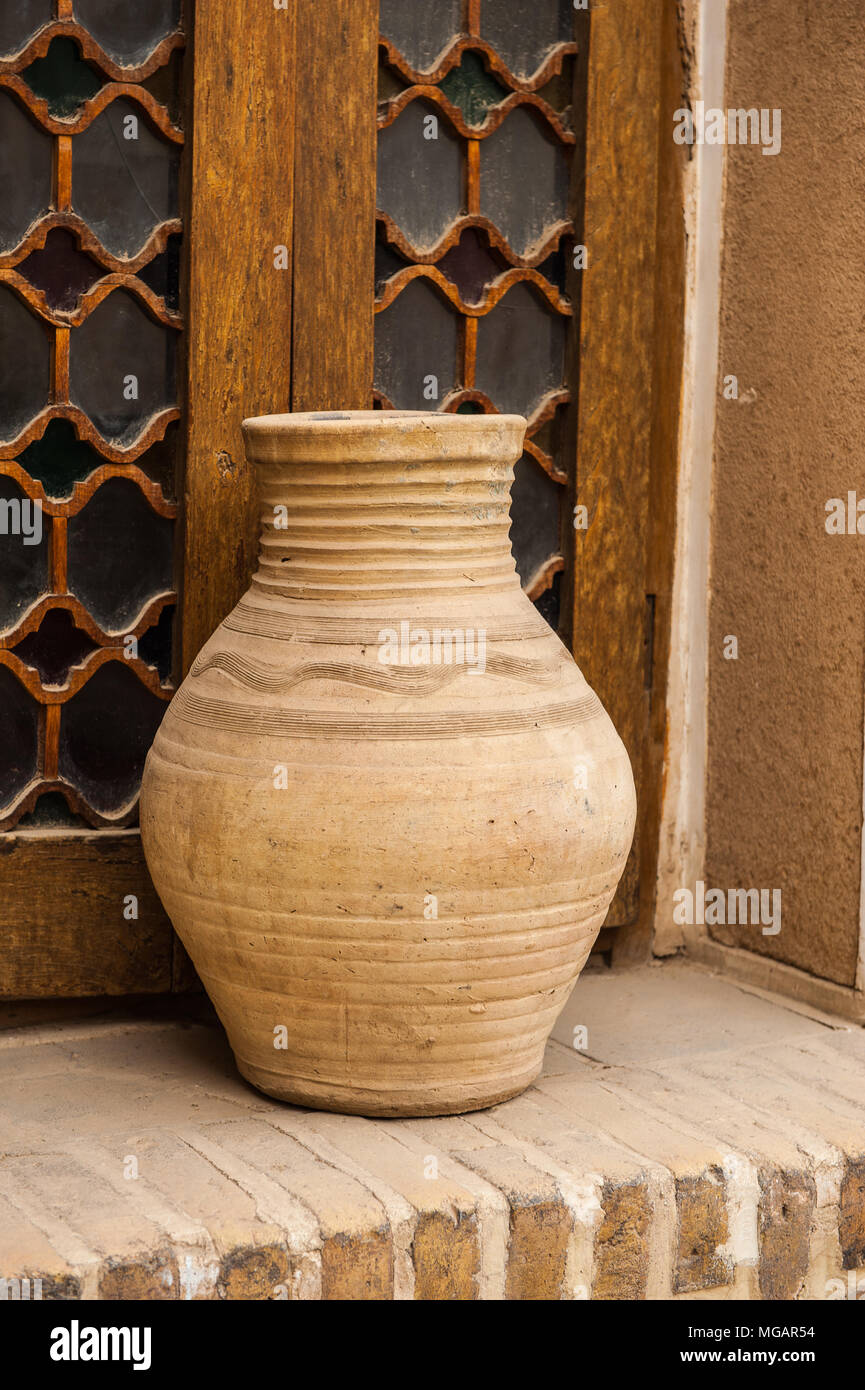 Clay jar near the window Stock Photo - Alamy