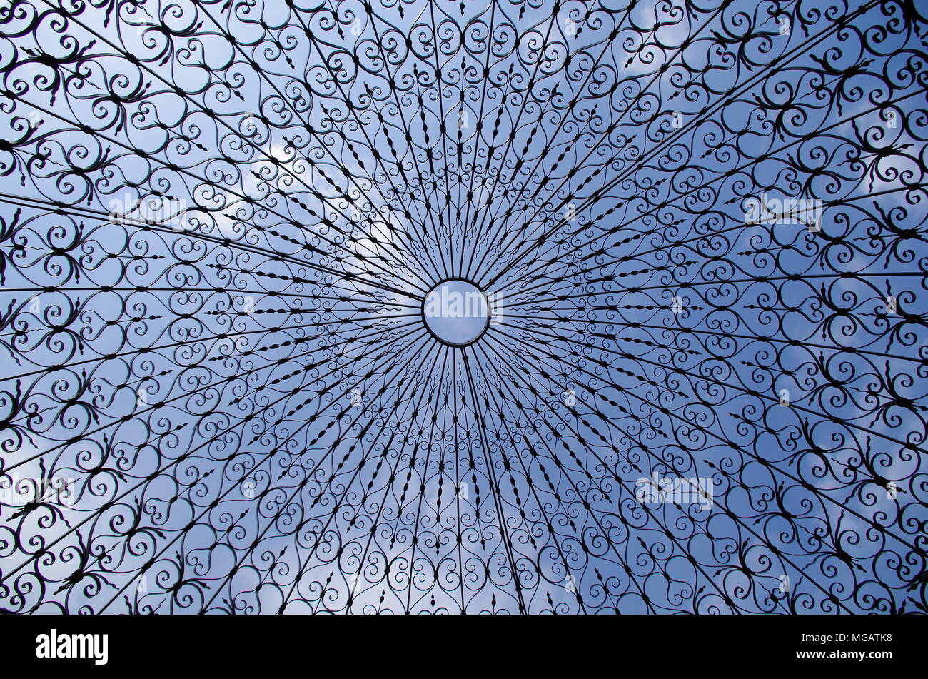 blue sky through filigree fence Stock Photo - Alamy