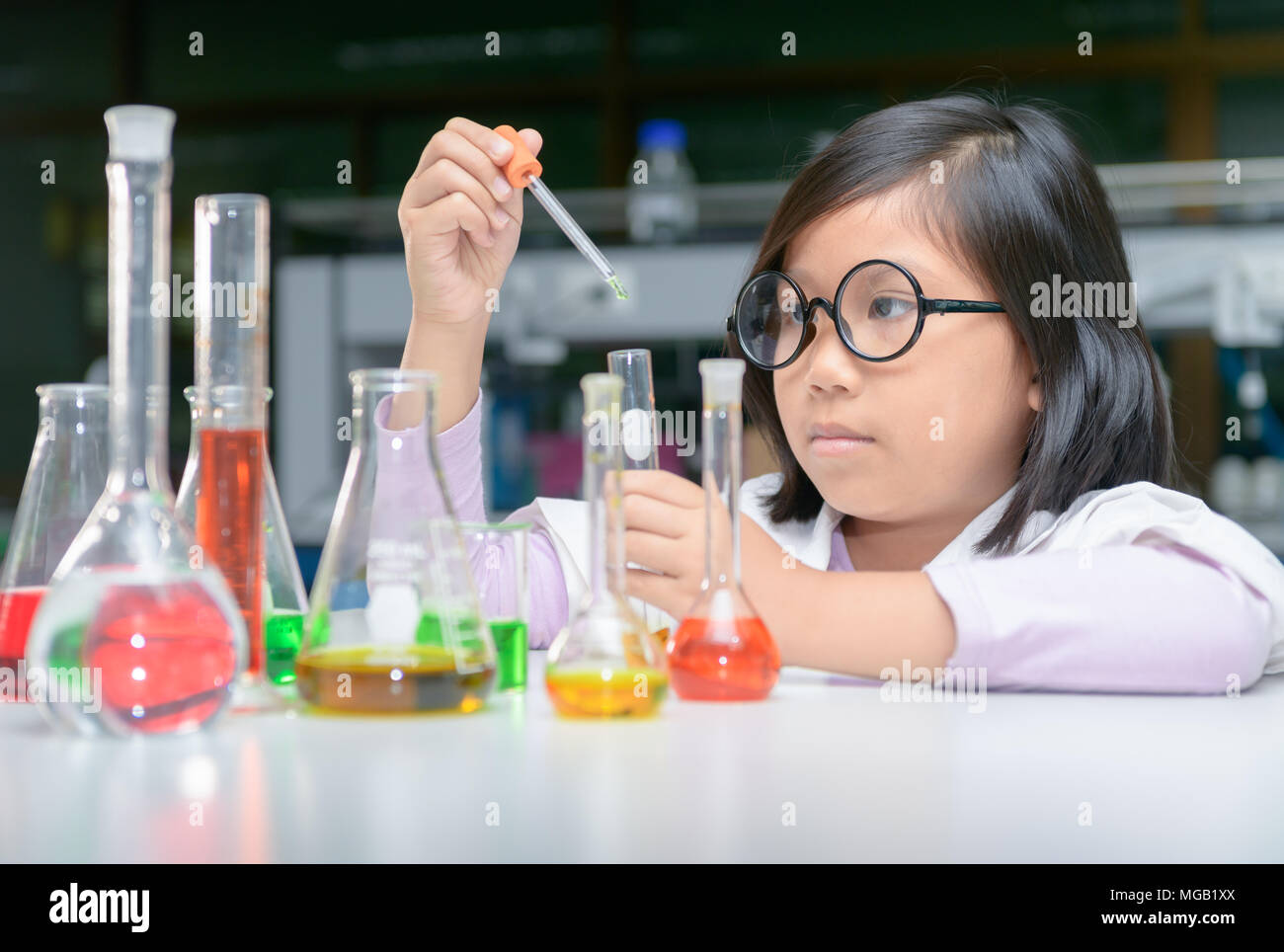Little scientist making experiment with test tube in chemical ...