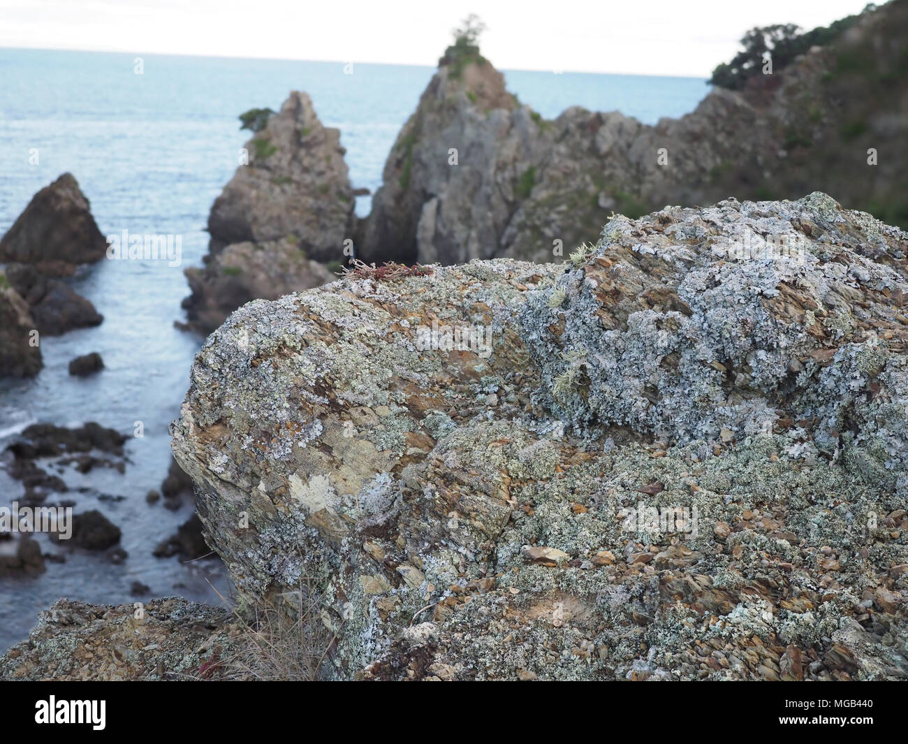 Rocky cliff edge with lichen Stock Photo - Alamy