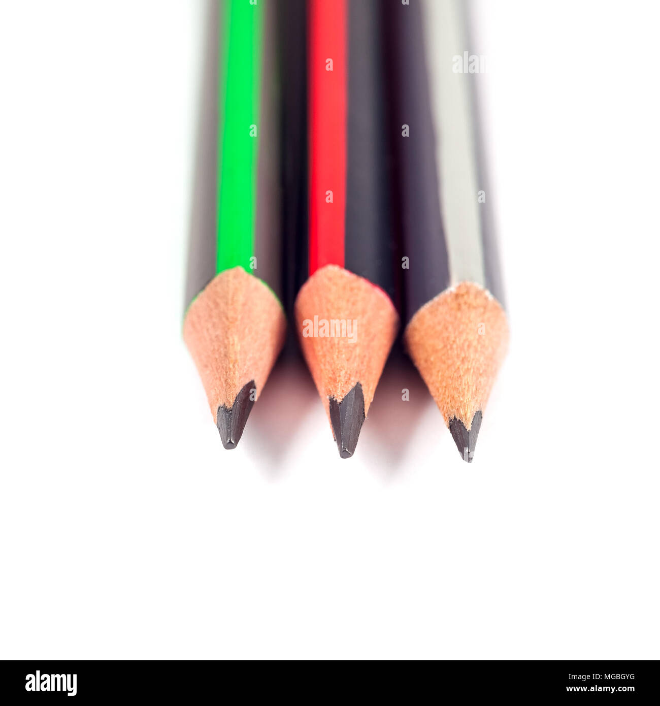 Three pencils on a white background Stock Photo - Alamy