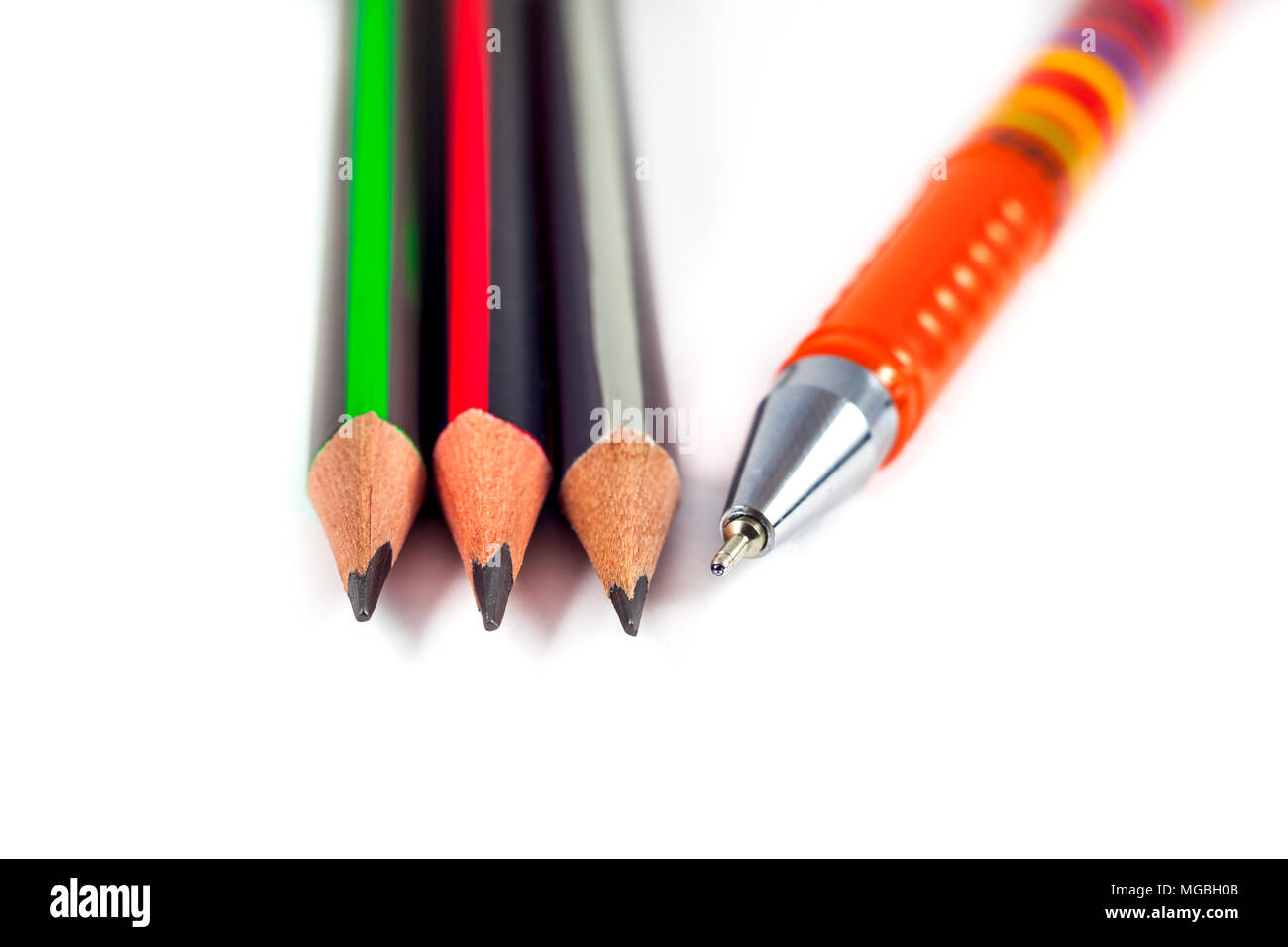 pencils and a pen on a white background Stock Photo - Alamy
