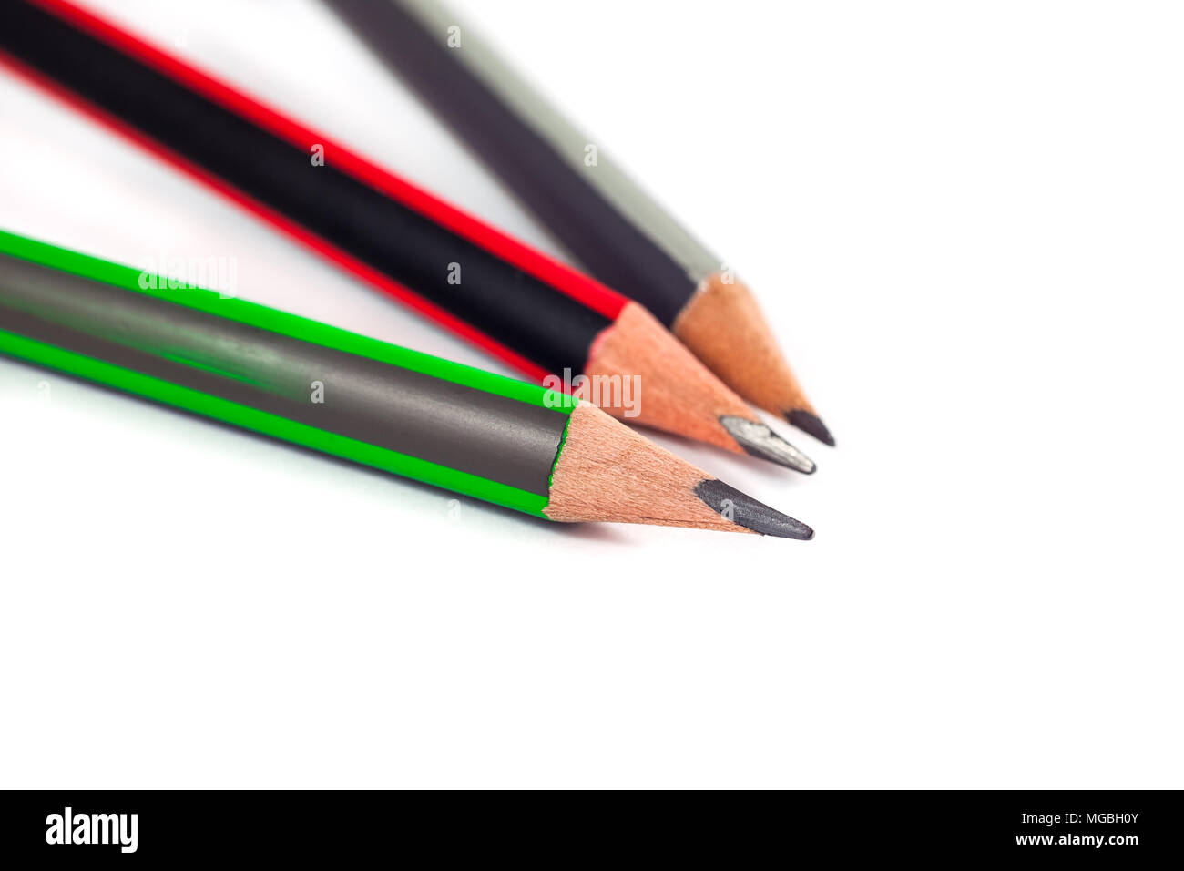 Three pencils on a white background Stock Photo - Alamy