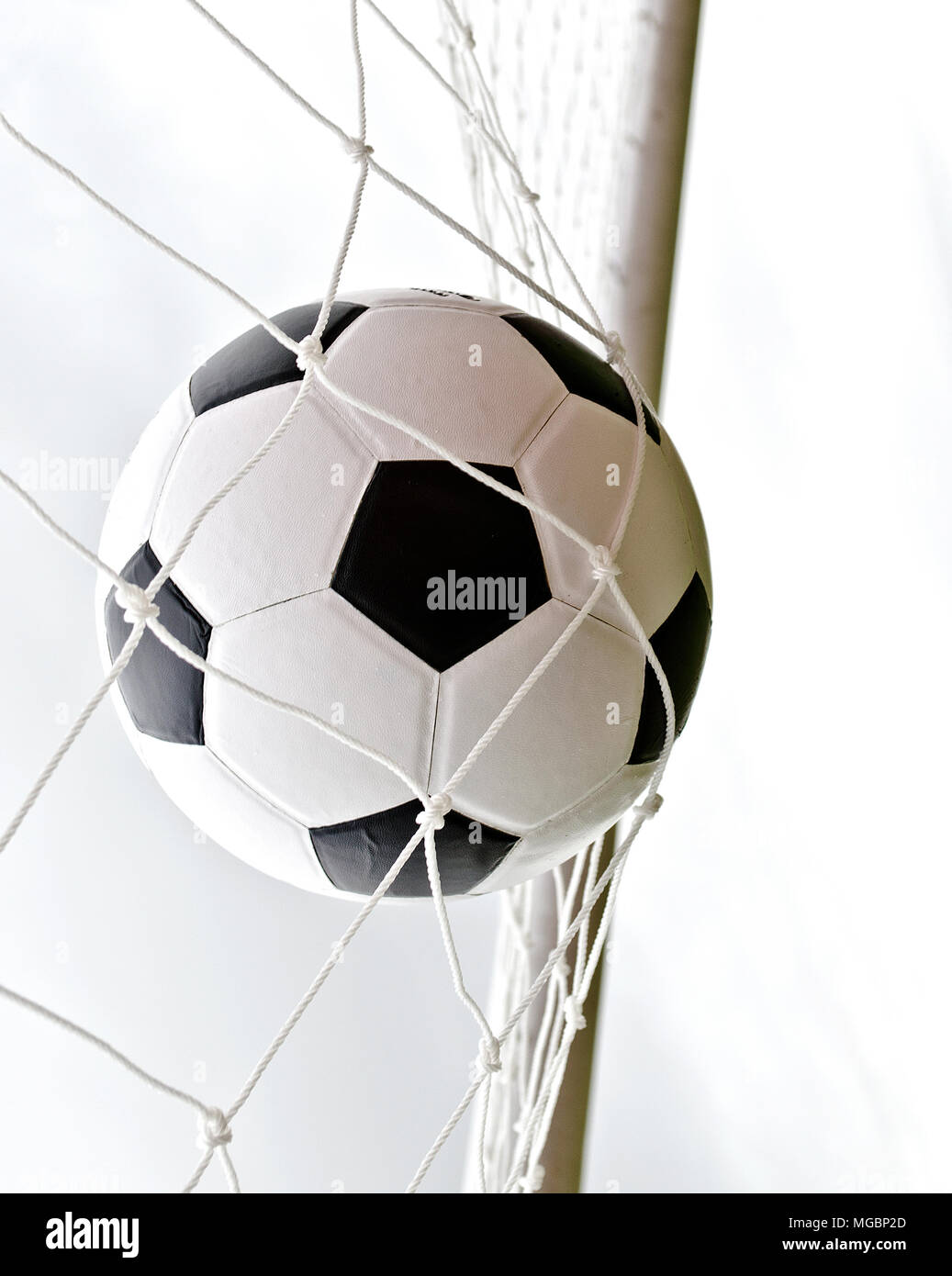 a soccer ball in the goal Stock Photo - Alamy