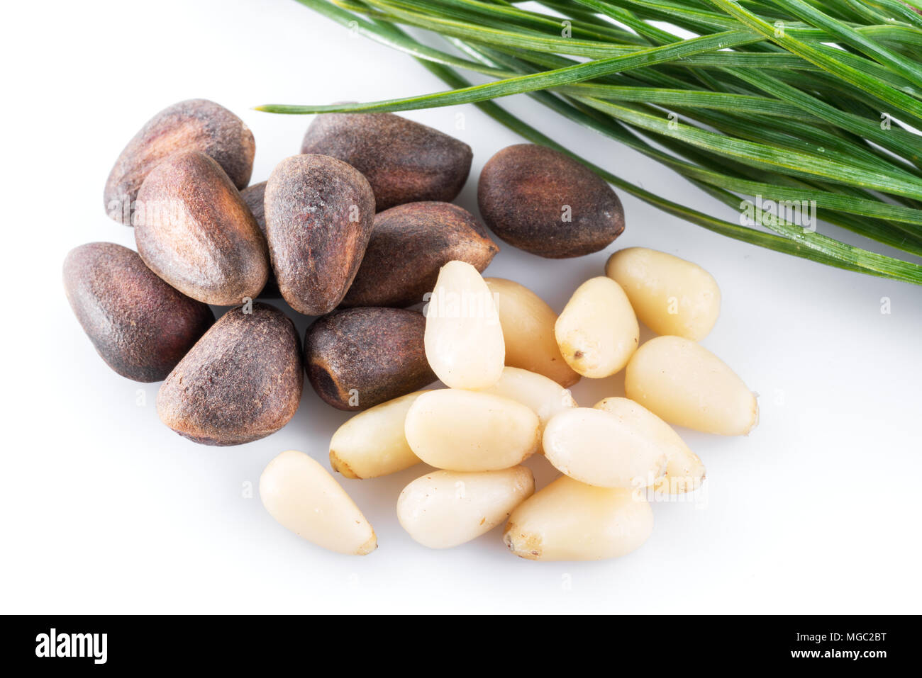 Pine nuts on the white background. Organic food Stock Photo - Alamy
