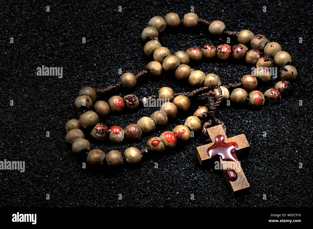 wooden rosary crucifix with blood drops Stock Photo - Alamy
