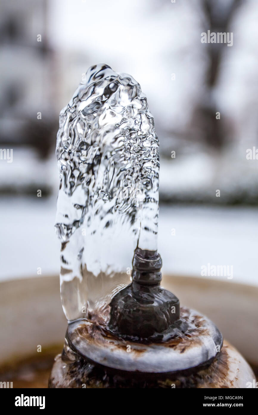 Close up water drops flowing from fountain Stock Photo - Alamy
