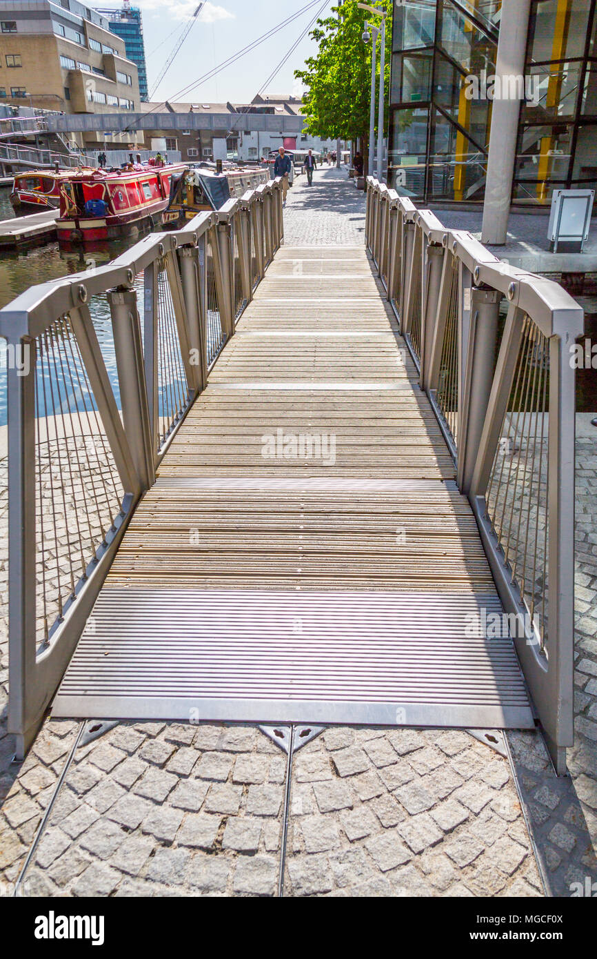 London, United Kingdom - May 13, 2015: Twice a week the Rolling Bridge ...