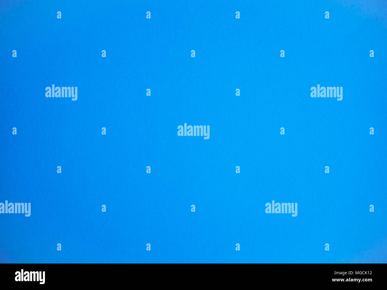 Bright blue color on a paper as a conceptual background Stock Photo - Alamy
