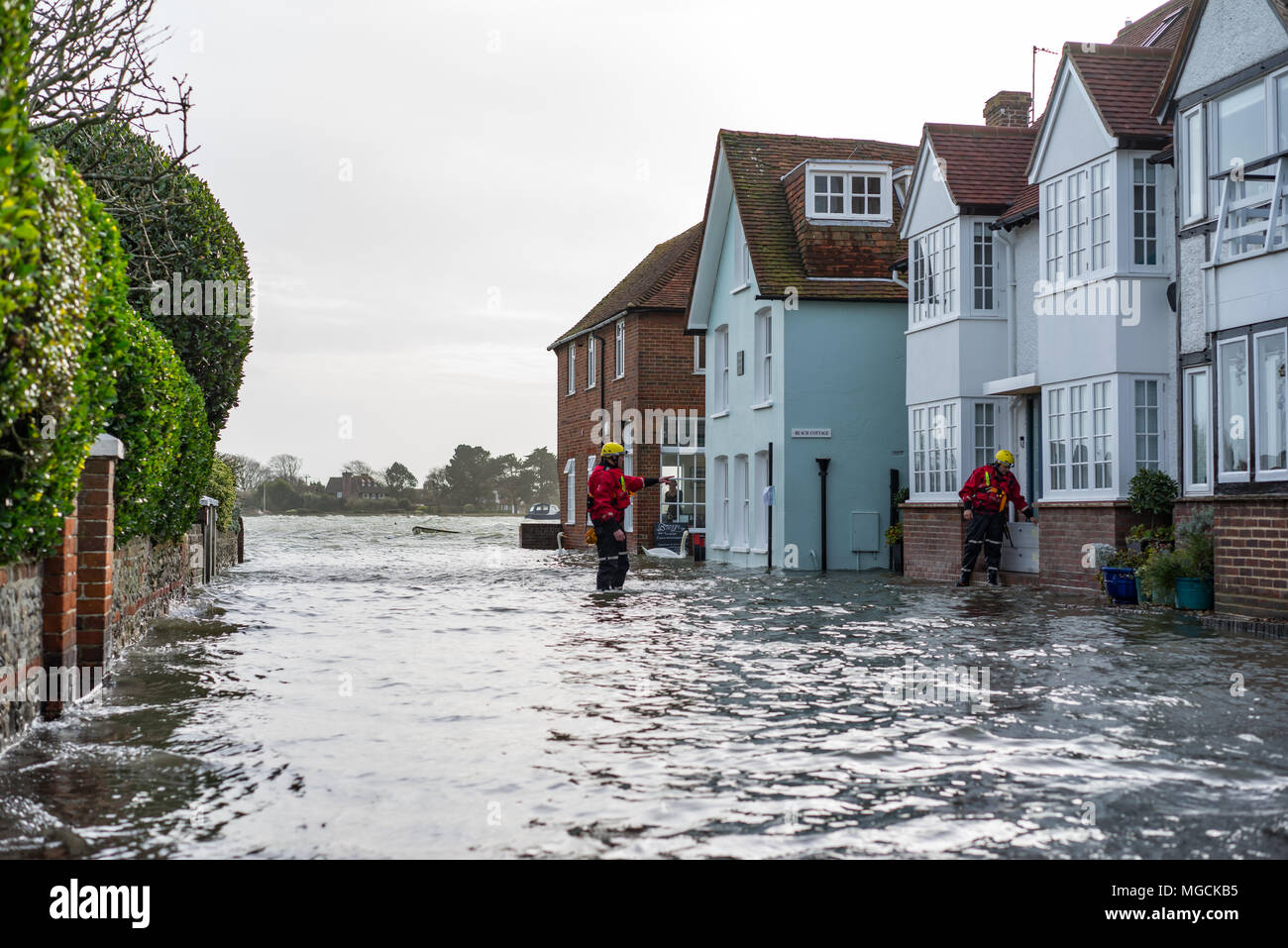 High tide in Bosham in Sussex, England with search and rescue checking ...