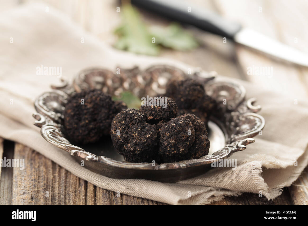 Black truffles on plate Stock Photo - Alamy