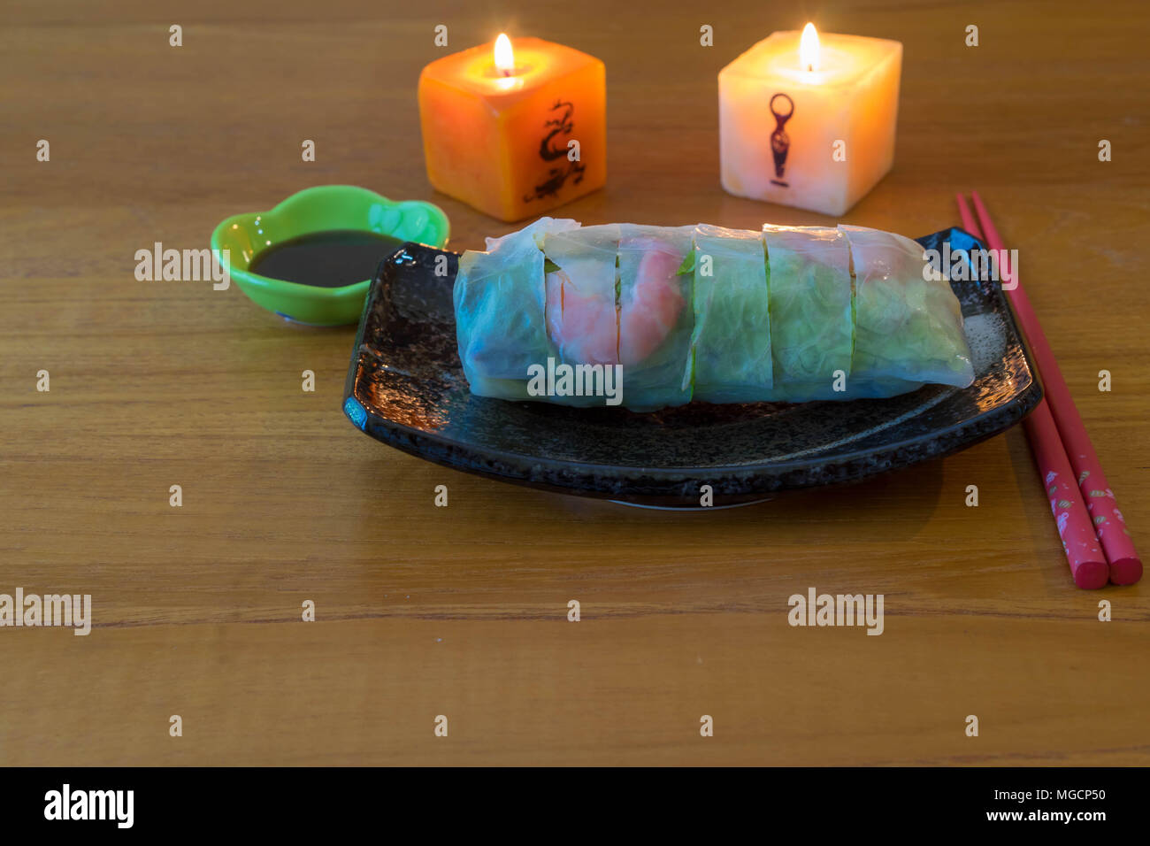 Asian Meal by Candlelight Stock Photo - Alamy
