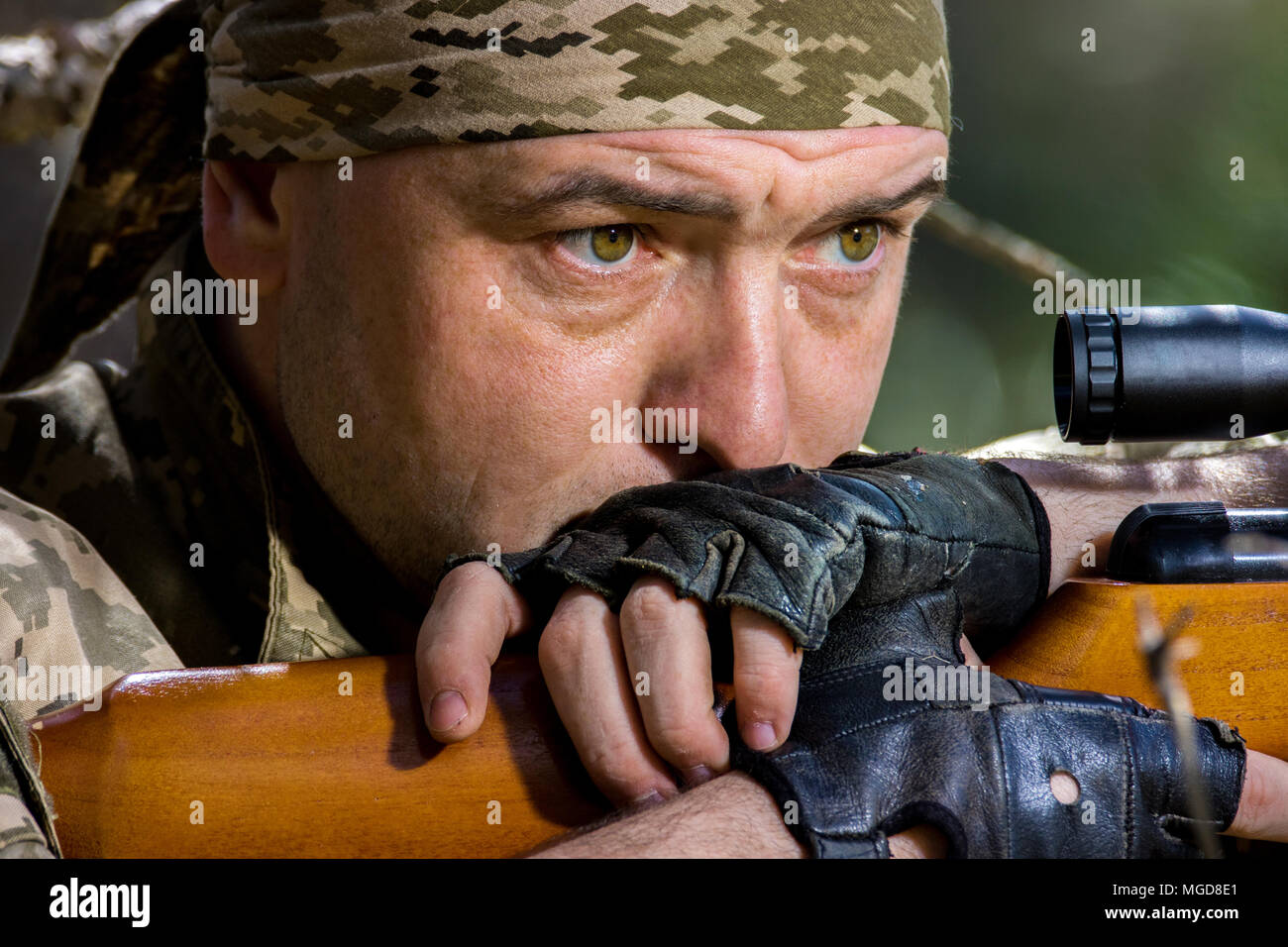 image of a young man with an air rifle Stock Photo - Alamy