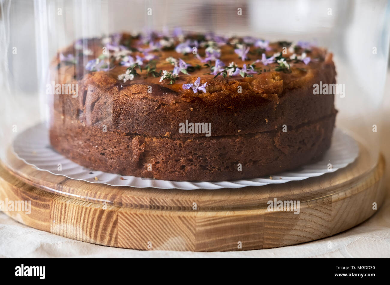 home baked cake with floral petals on display Stock Photo - Alamy