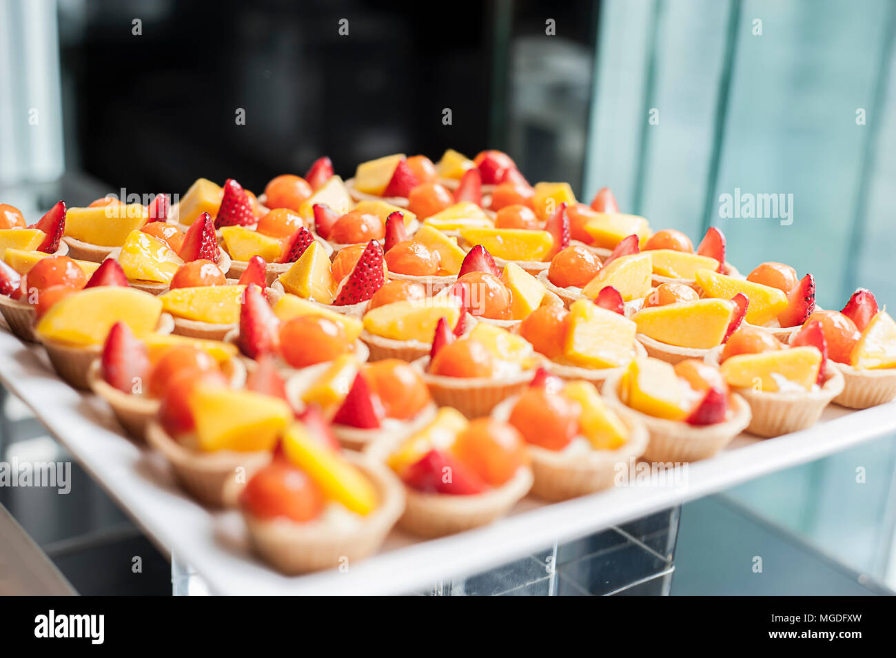 Luxury sweet dessert and mixed fruit in dinner party Stock Photo - Alamy