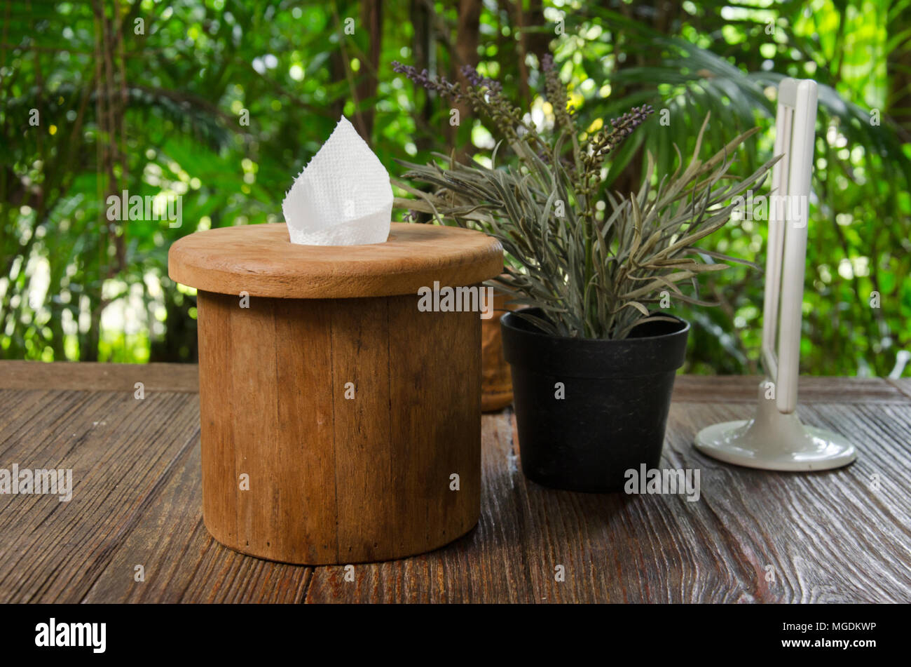 Tissue paper in wooden box on wood table in coffee shop and restaurant ...