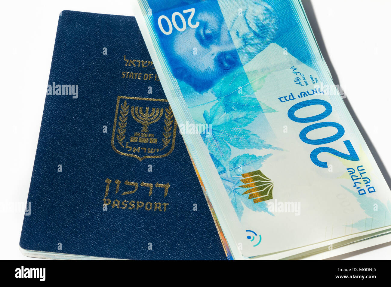 Stack of israeli money bills of 200 shekel and israeli passport - Top ...