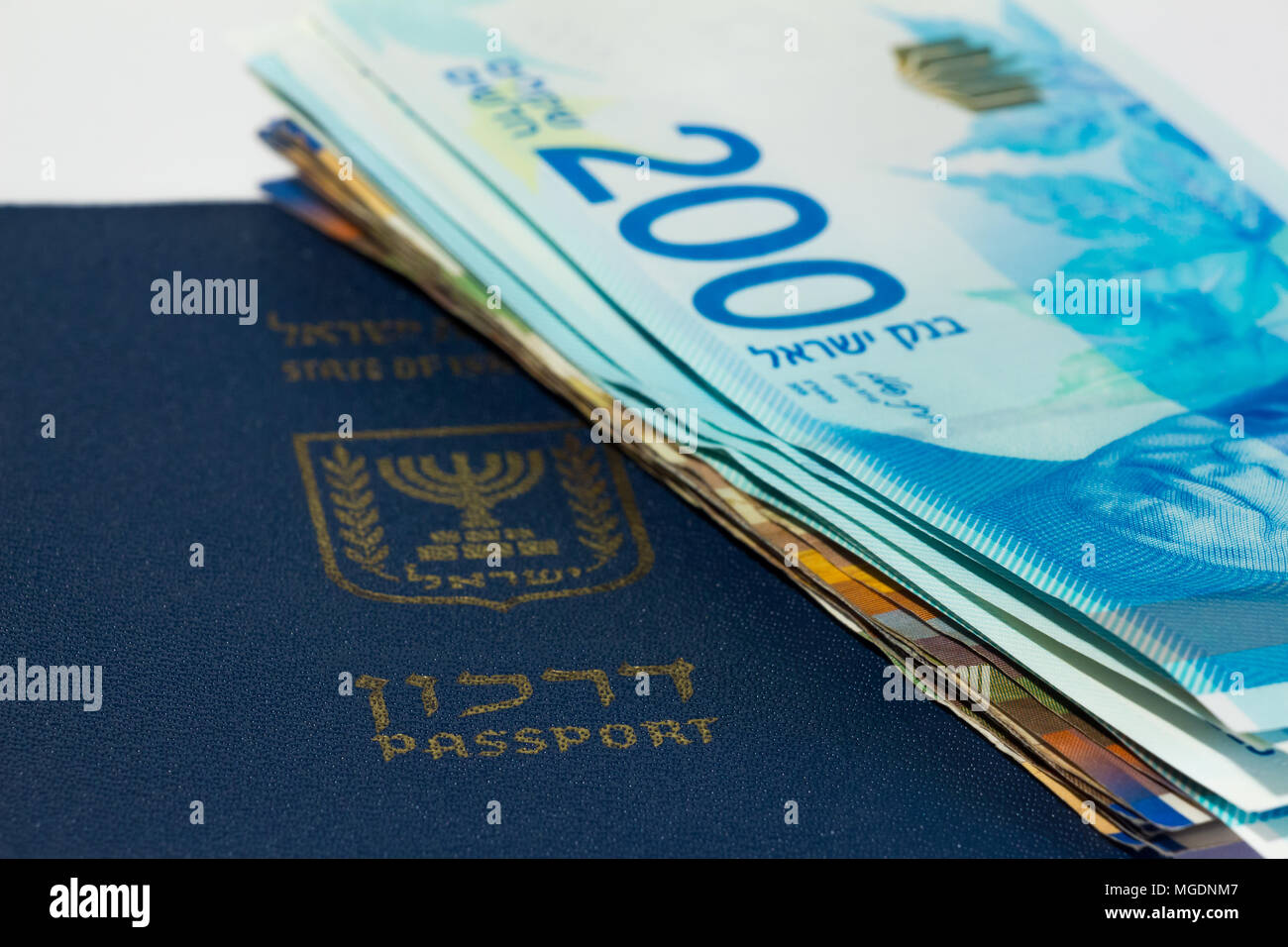 Stack of israeli money bills of 200 shekel and israeli passport Stock ...