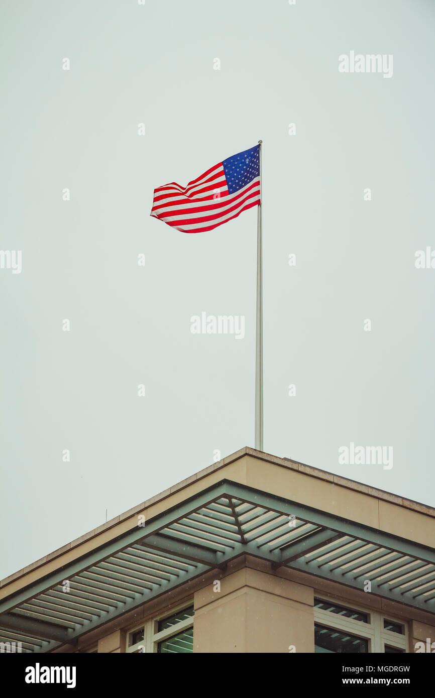 American flag on top of the US Embassy in Berlin on a winter day Stock ...
