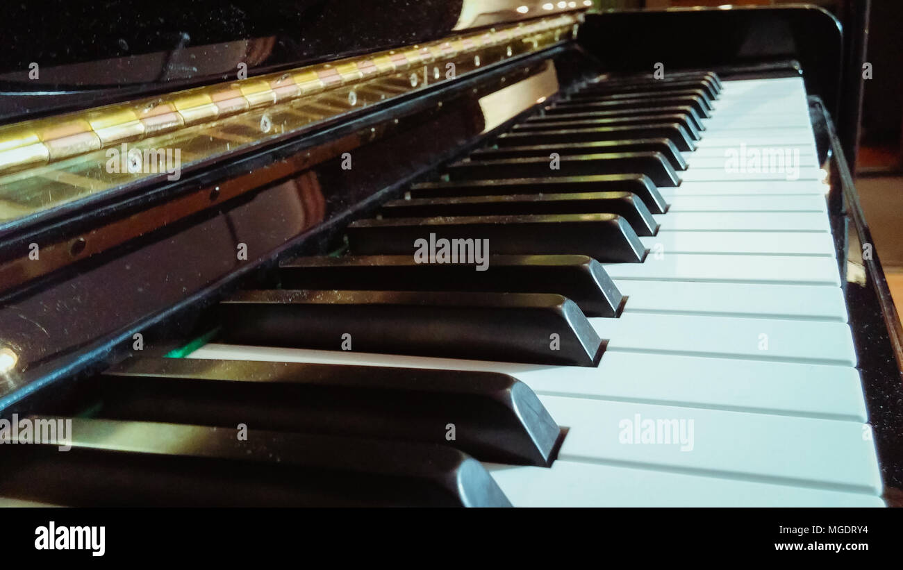 Close up of piano keys. Side view Stock Photo - Alamy