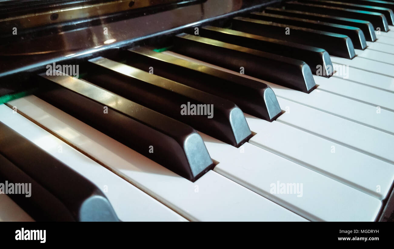 Close up of piano keys. Side view Stock Photo - Alamy