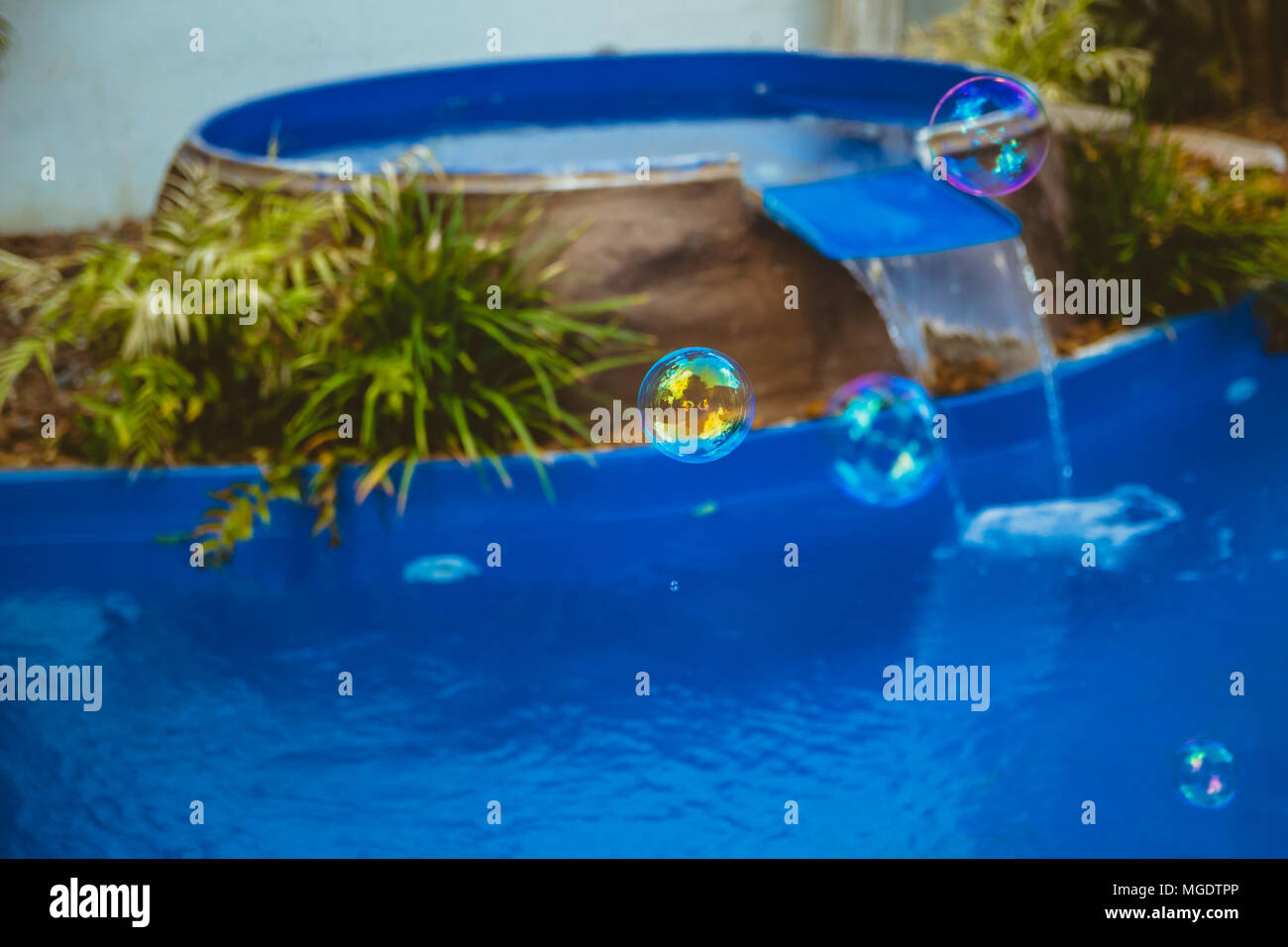 Soap bubbles fly in the swimming pool Stock Photo - Alamy