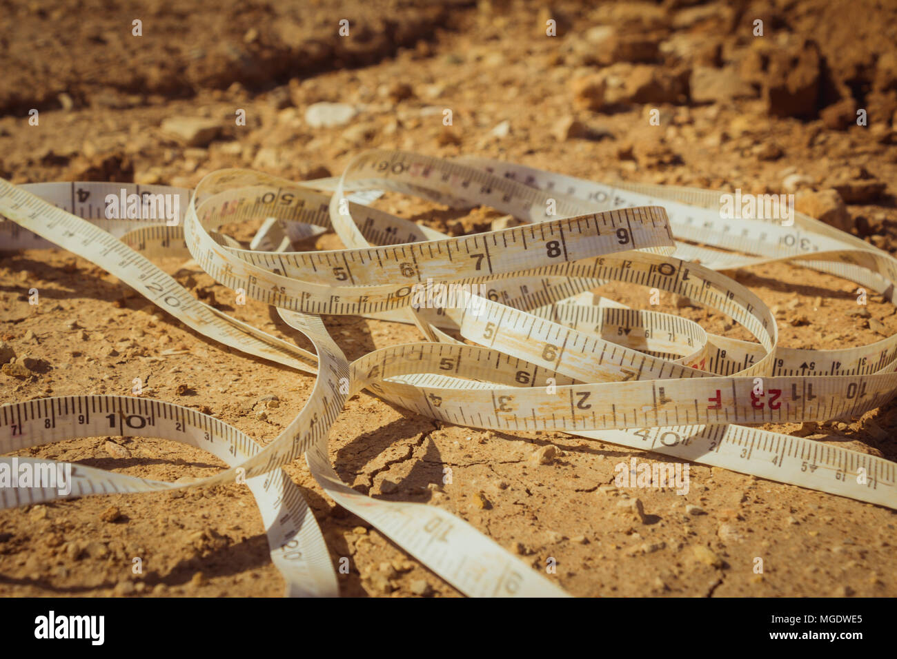 Measuring tape placed on the ground at a construction site Stock Photo ...