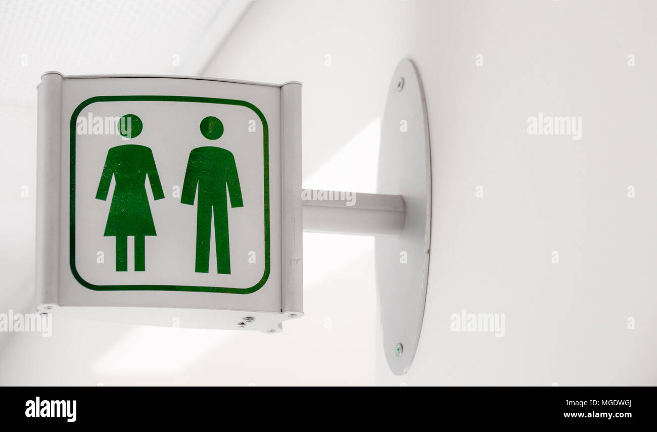 Public modern white and green restroom sign on white wall Stock Photo ...